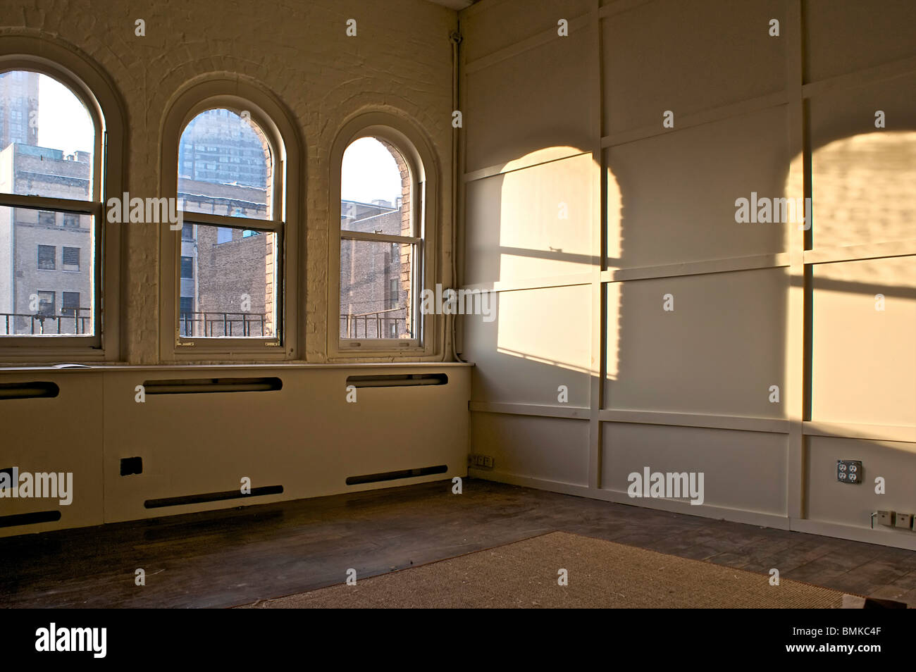 large empty room with arched windows in old building Stock Photo - Alamy