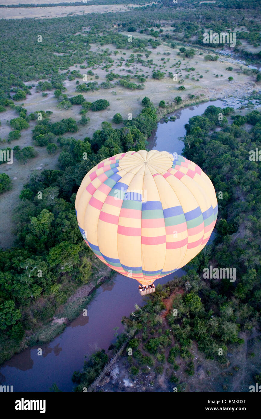 Africa, Kenya, Masai Mara. Tourists ballooning over the Talek river ...