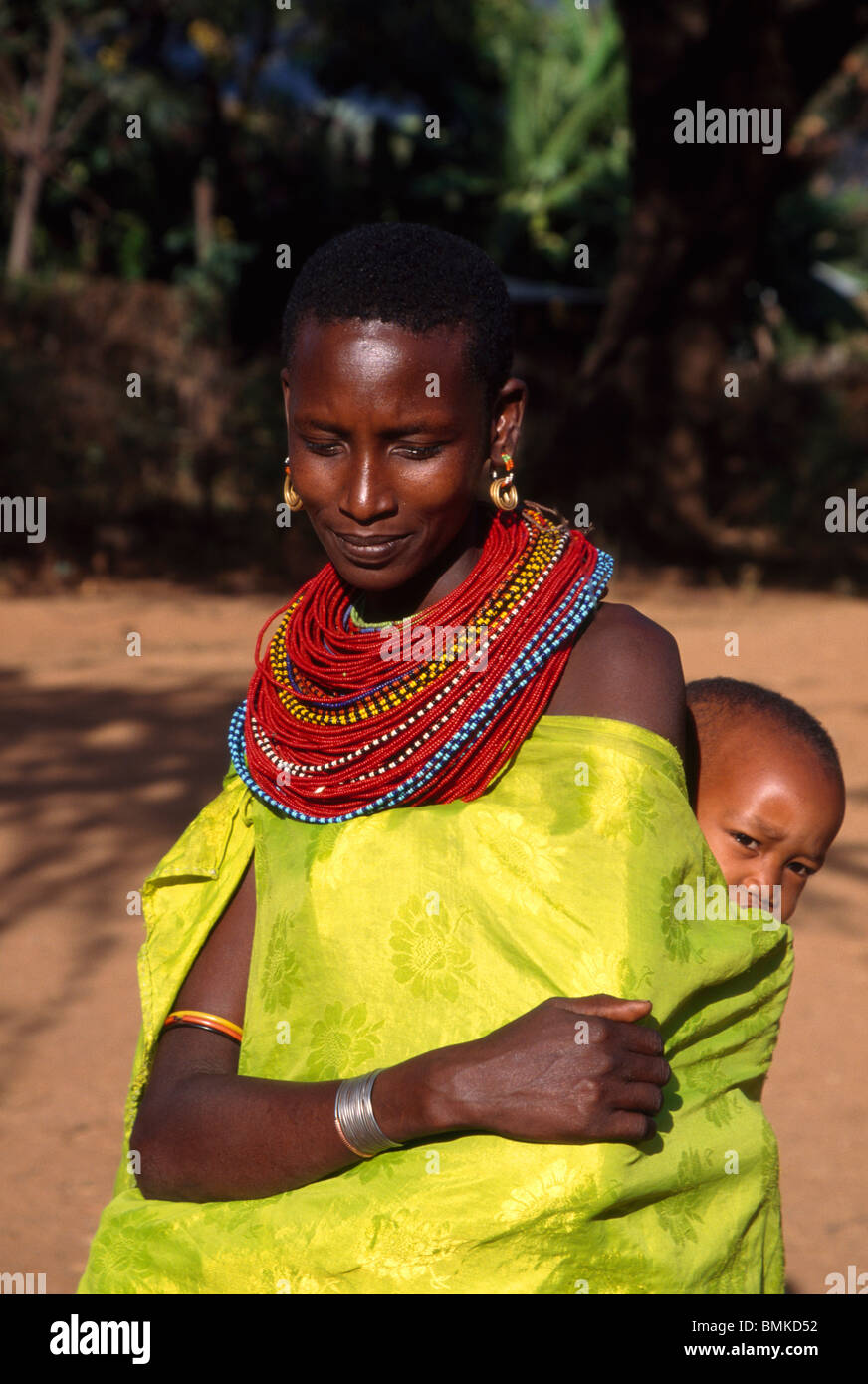 Africa. Kenya. Turkana. Turkana woman with baby on her back near Lake ...