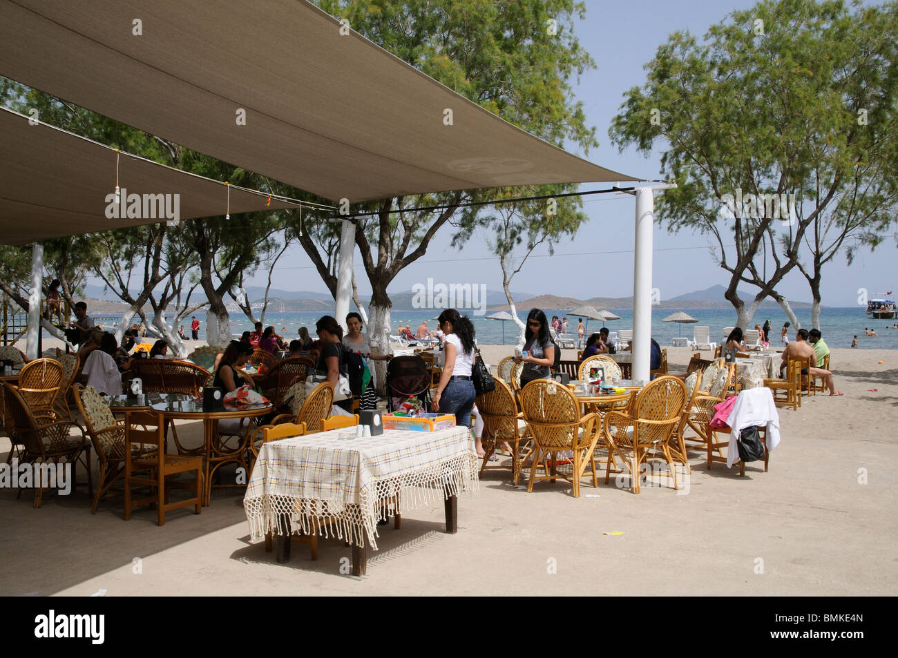 Holidaymakers in a beach restaurant at Camel Beach a seaside resort ...