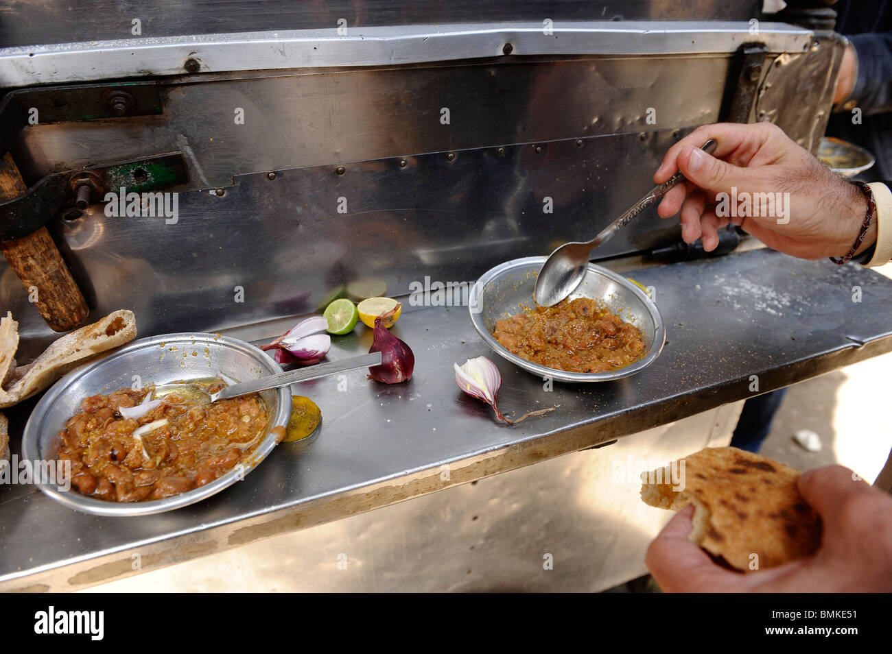 egyptian men having breakfast ( fuul with local traditional bread ...