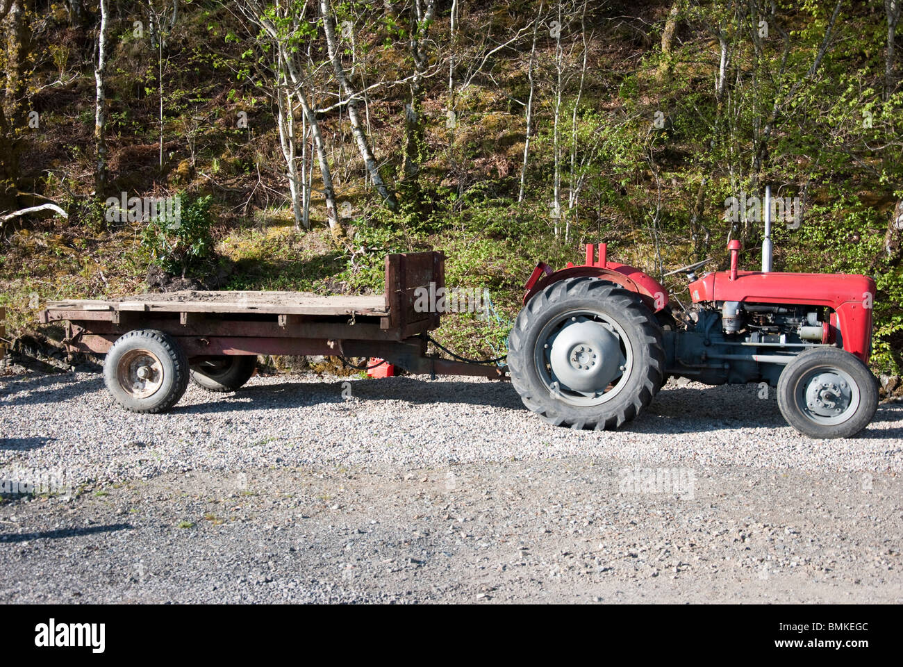 Old Red & Grey Farm Tractor & Flatbed Trailer Stock Photo - Alamy
