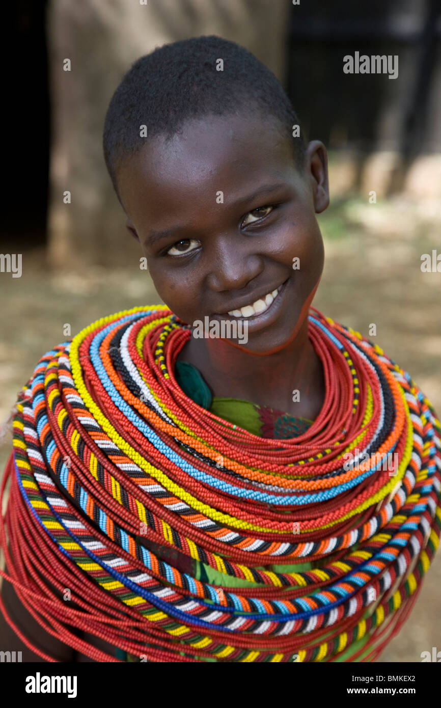 Africa. Kenya. A young Samburu woman in colorful, traditional dress at ...