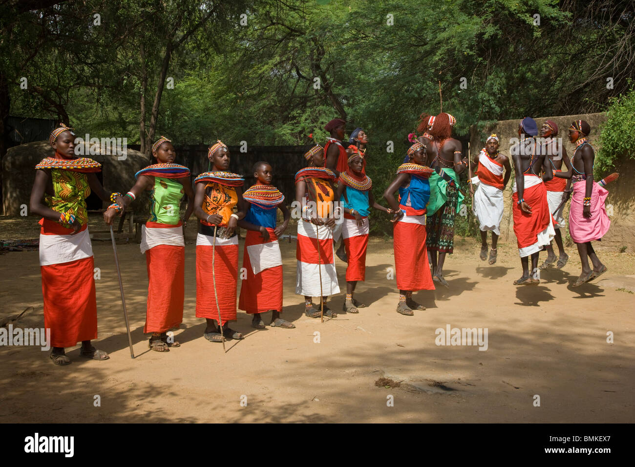 Africa. Kenya. Young Samburu morani dance with women in colorful ...