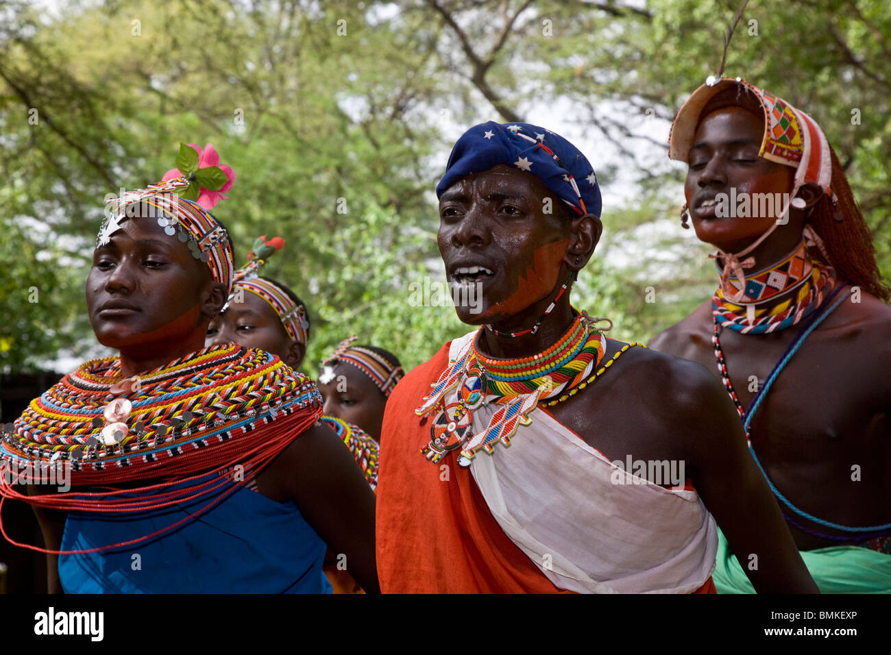 Africa. Kenya. Young Samburu morani dance with women in colorful ...