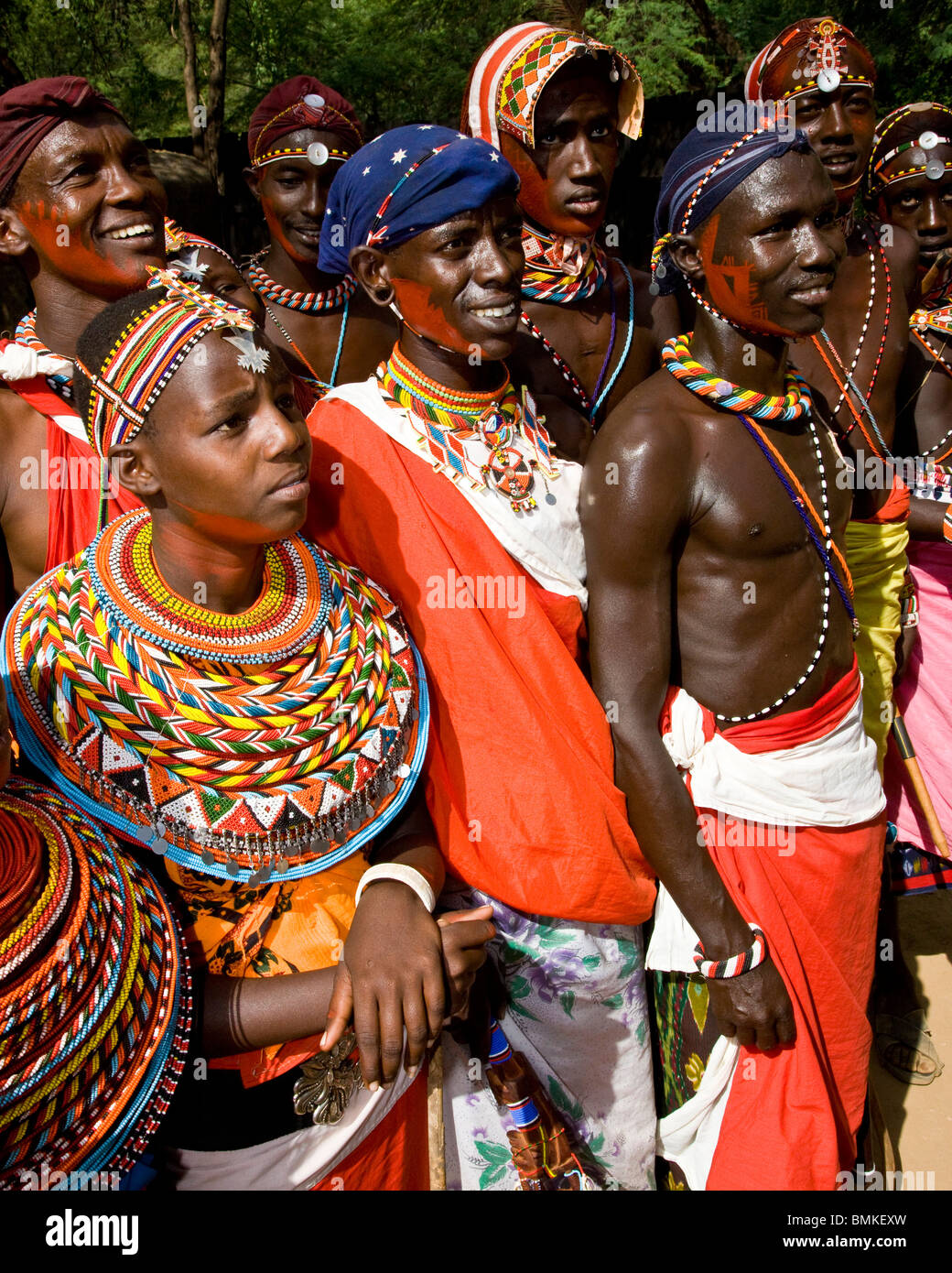 Africa. Kenya. Young Samburu morani dance with women in colorful ...