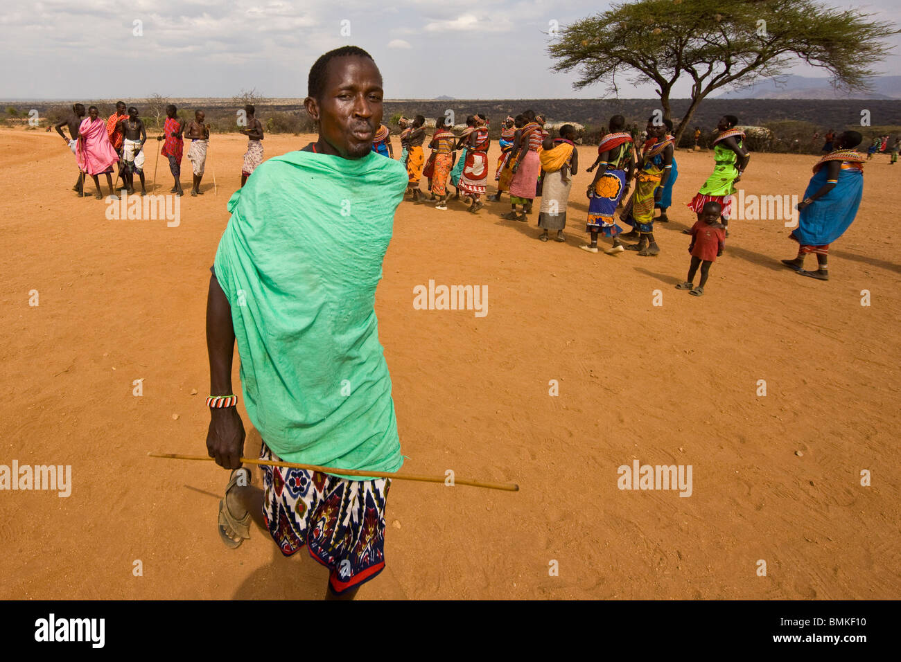 Africa. Kenya. Young Samburu morani dance with women in colorful ...