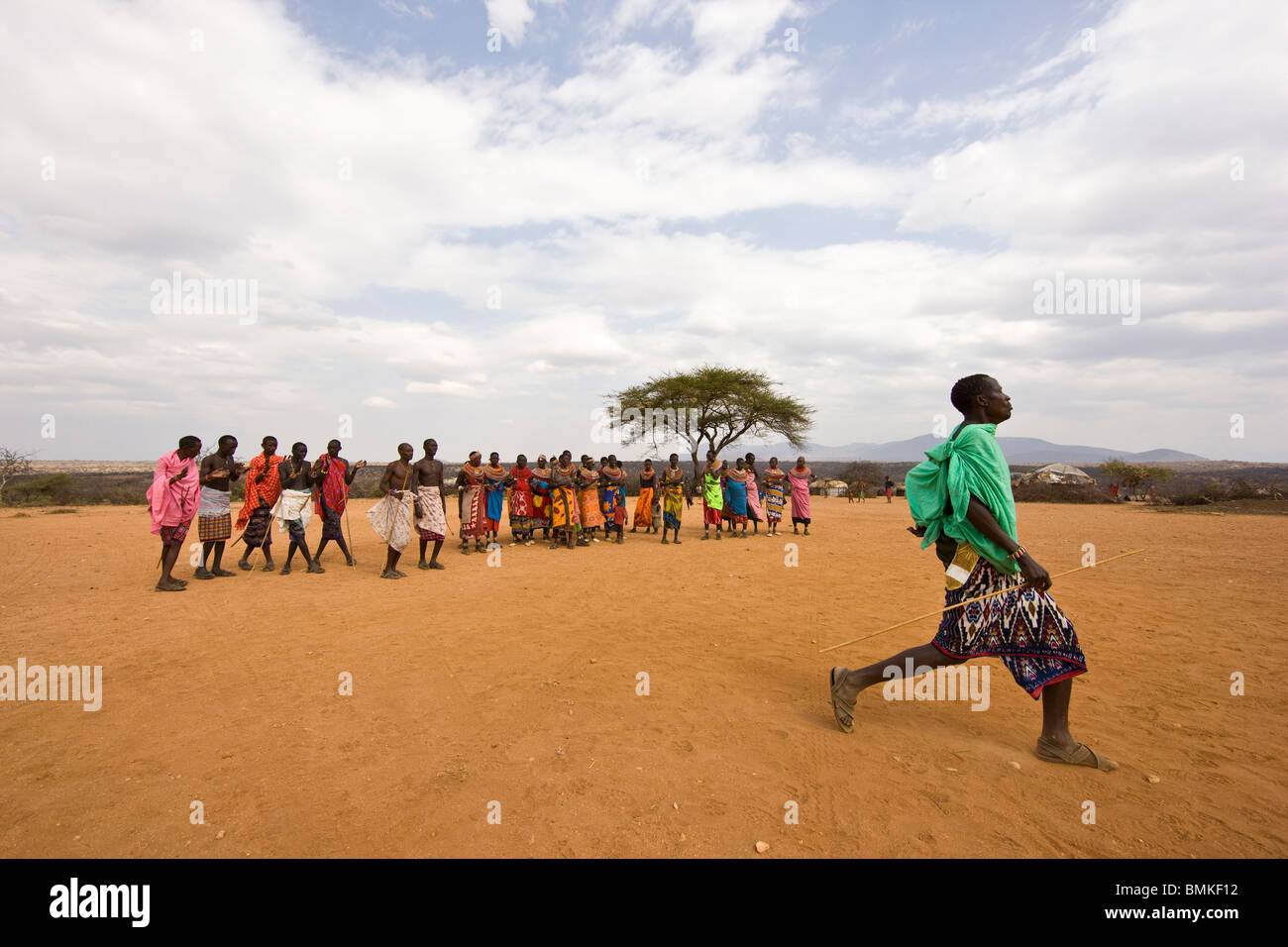 Africa. Kenya. Young Samburu morani dance with women in colorful ...