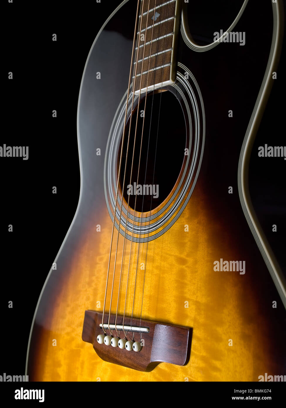 acoustic guitar against black background, closeup shot Stock Photo - Alamy