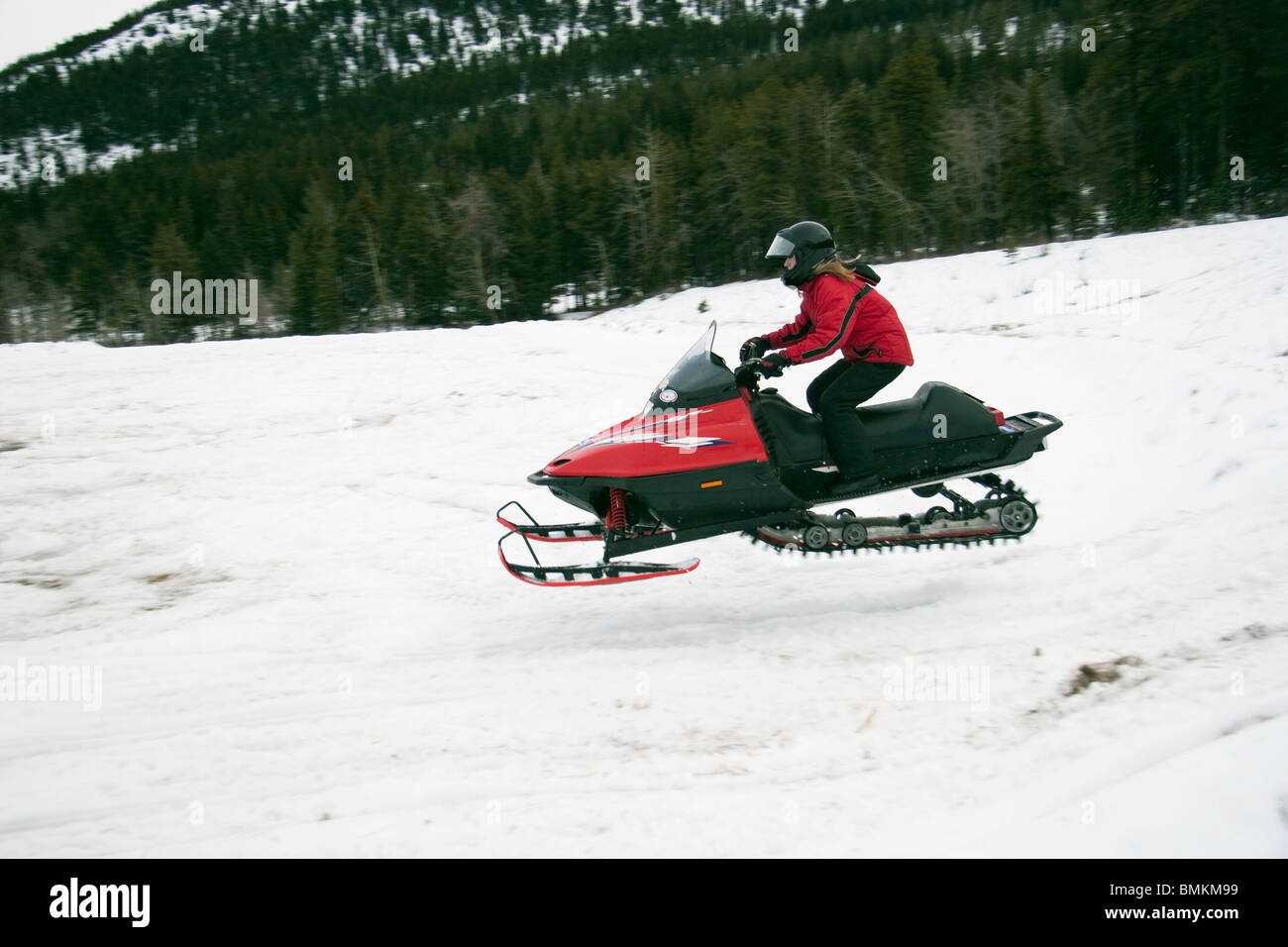 Snowmobile In The Air Stock Photo - Alamy