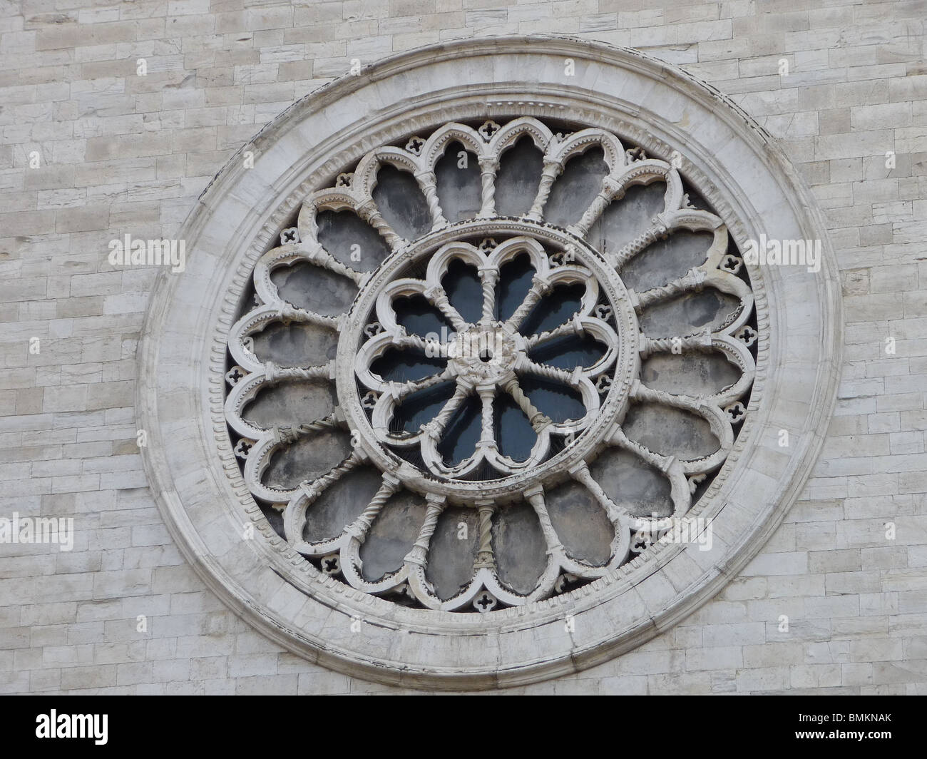 The rose window of the facade of the church of San Francesco Stock ...