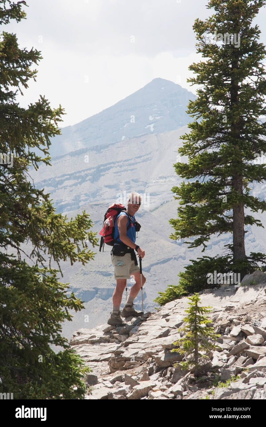 Man Hiking On A Mountain Path Stock Photo - Alamy