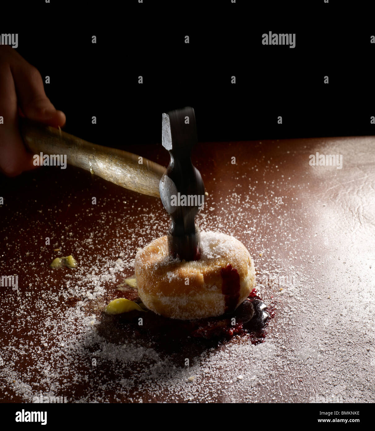 Doughnut being smashed by a hammer Stock Photo - Alamy