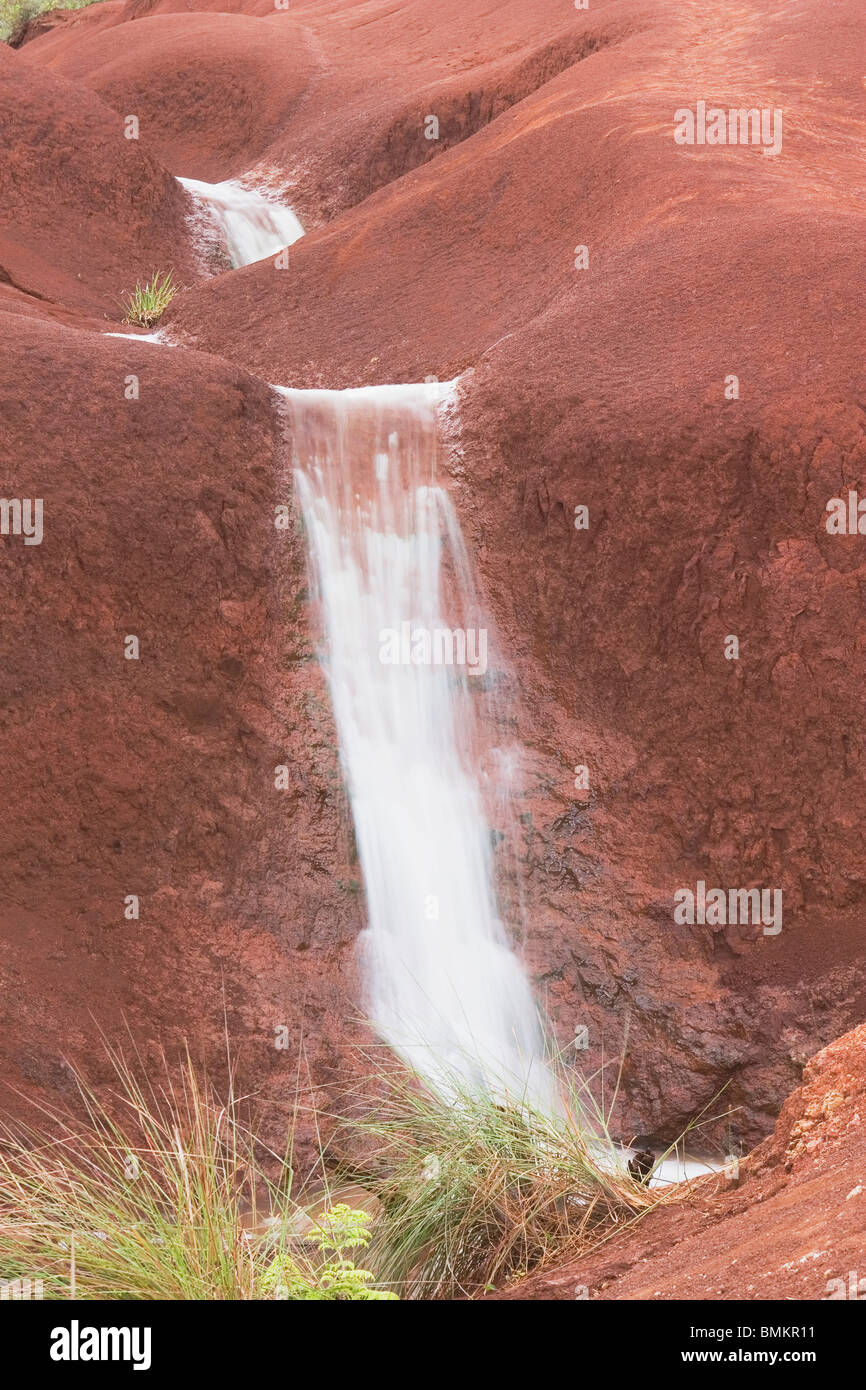 West Kauai, Hawaii; Waterfalls On Red Rock At Waimea Canyon Stock Photo ...