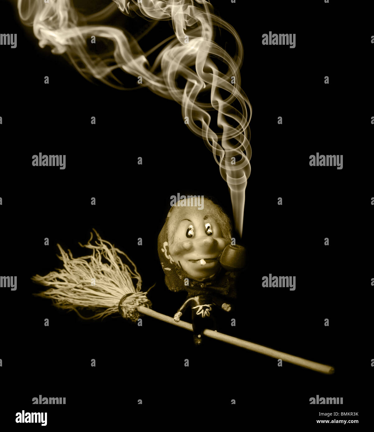 merry witch flying on broom and smoke pipe Stock Photo - Alamy