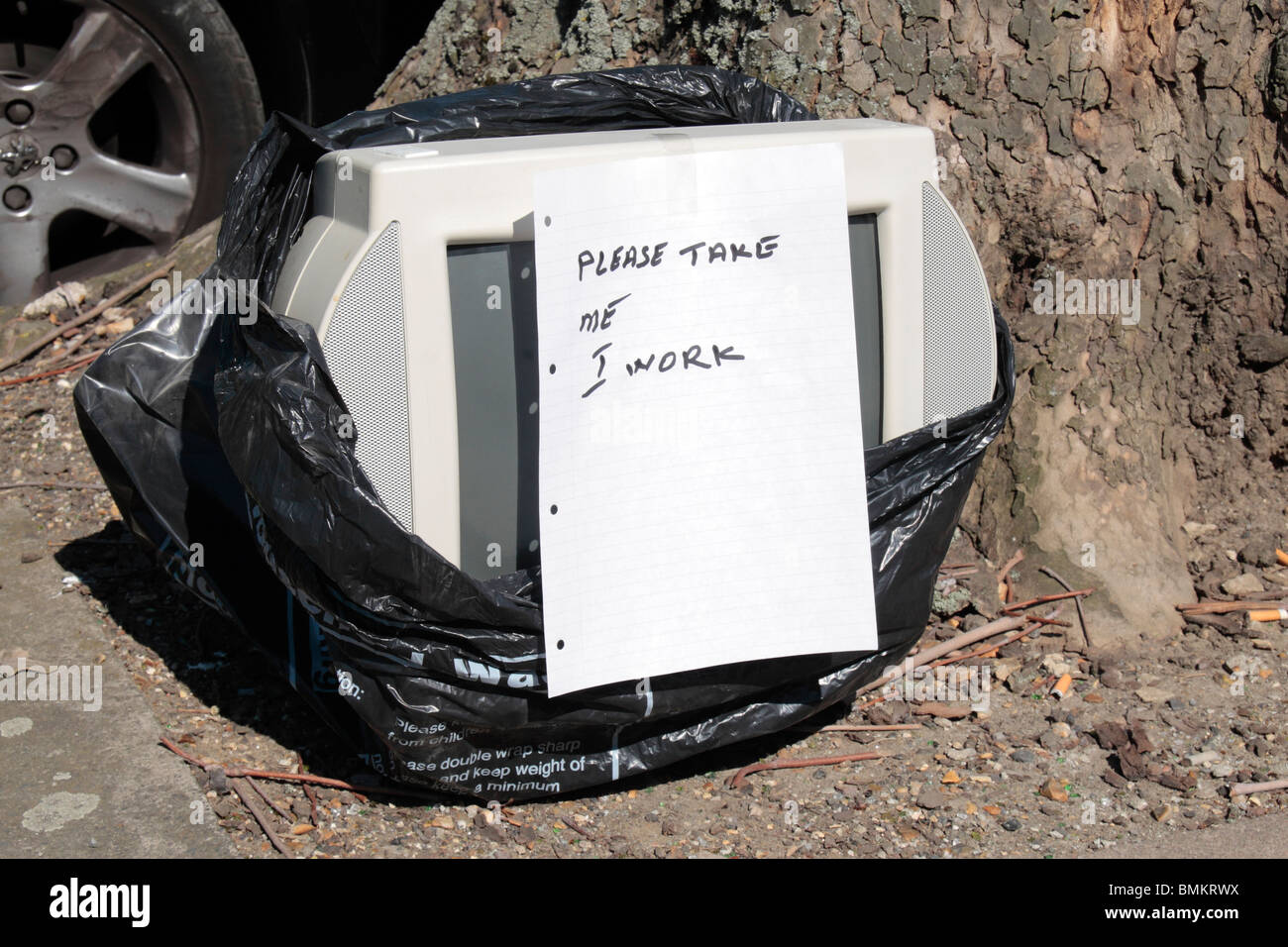An abandoned computer monitor by a tree with the amusing message ...