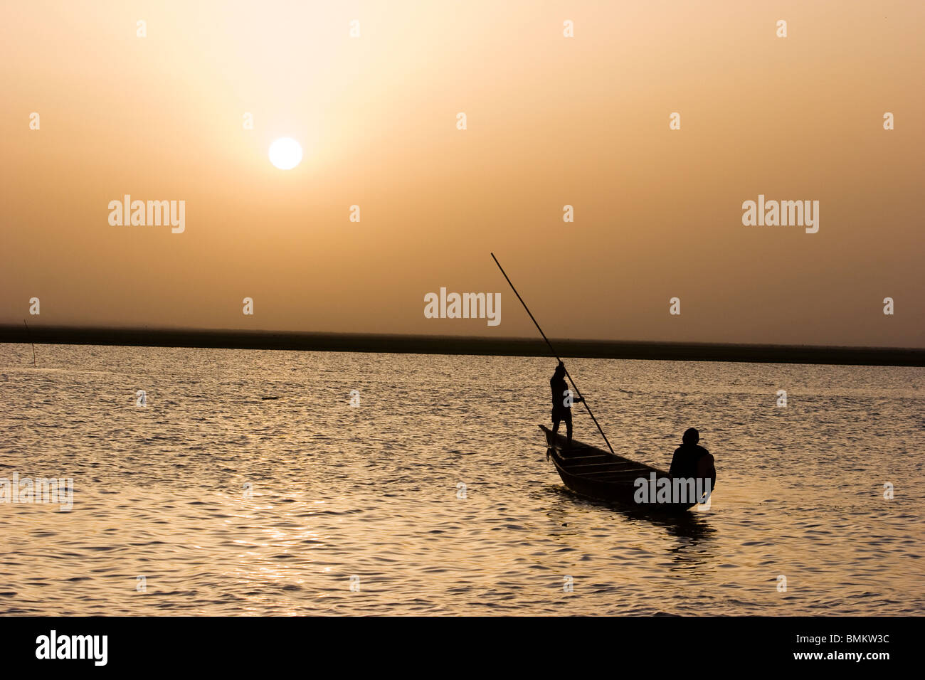 Mali, Lake D'Ebo. Fishing boat in the sunset over Lake Debo - Niger ...