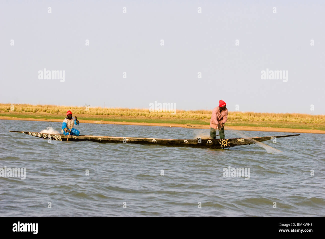 Mali, Mopti. People in pirogues (small boats) fishing in the Niger ...