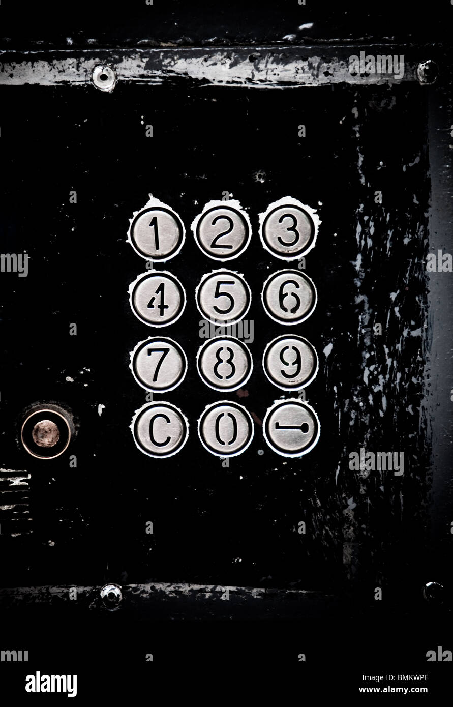 old nipped black intercom buttons. vertical shot Stock Photo - Alamy