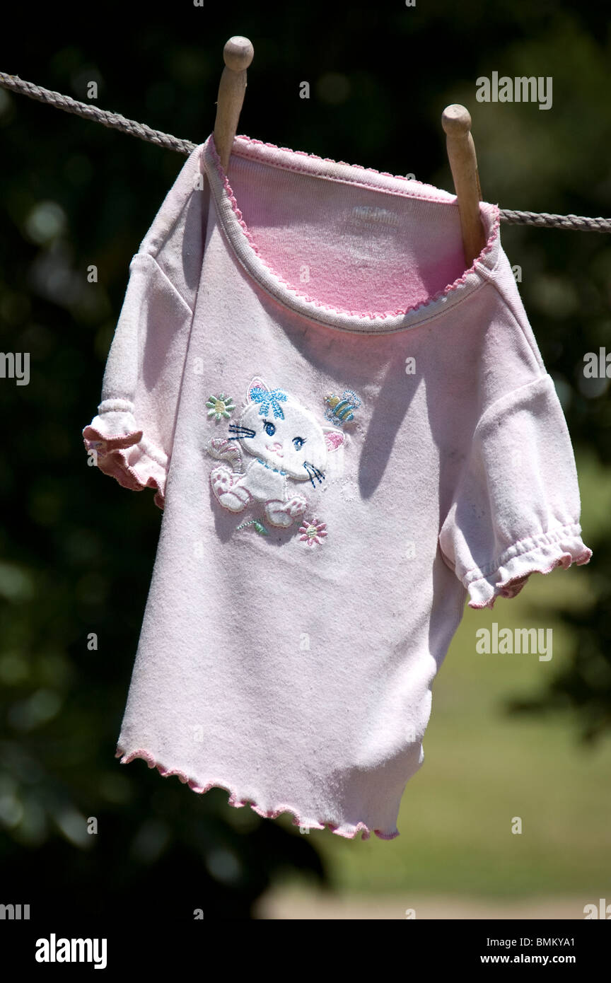 Children's clothes hanging on a clothes line Stock Photo - Alamy