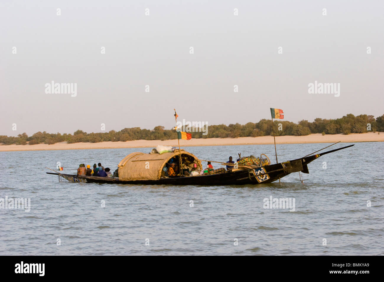 Mali, Niafunke. Pinasse carrying cargo and people on the Niger River ...