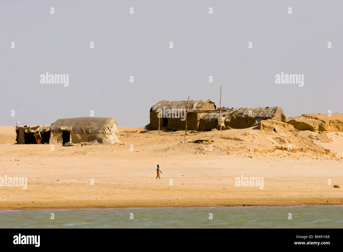 Mali, Niafunke. Mud houses along the shores of the Niger River between ...
