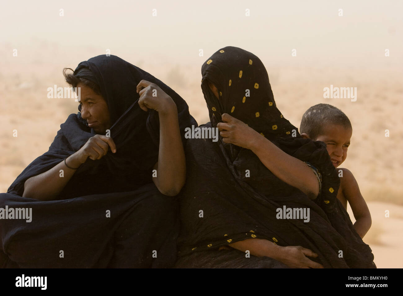 Mali, Timbuktu. Tuareg women and children on a sand dune Stock Photo ...