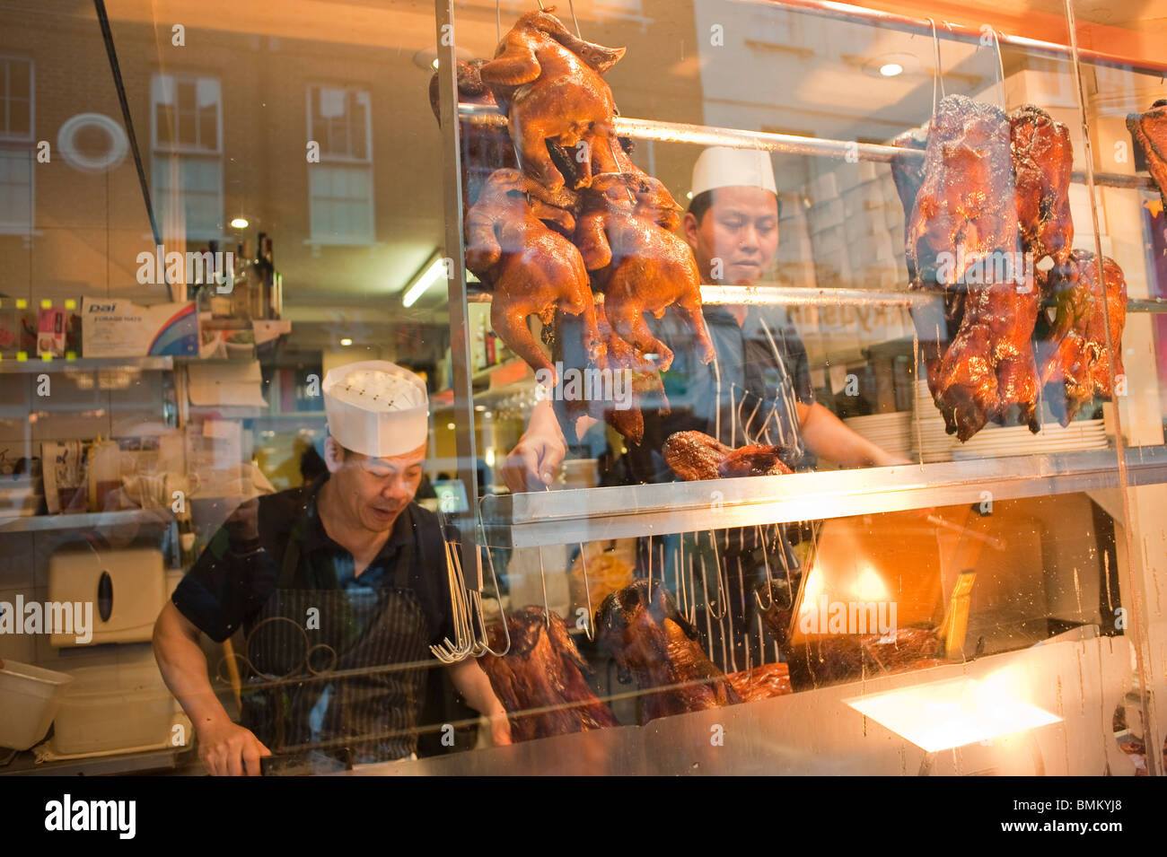 London, UK, Chinatown, Chefs in Window, Chinese Restaurants, working ...