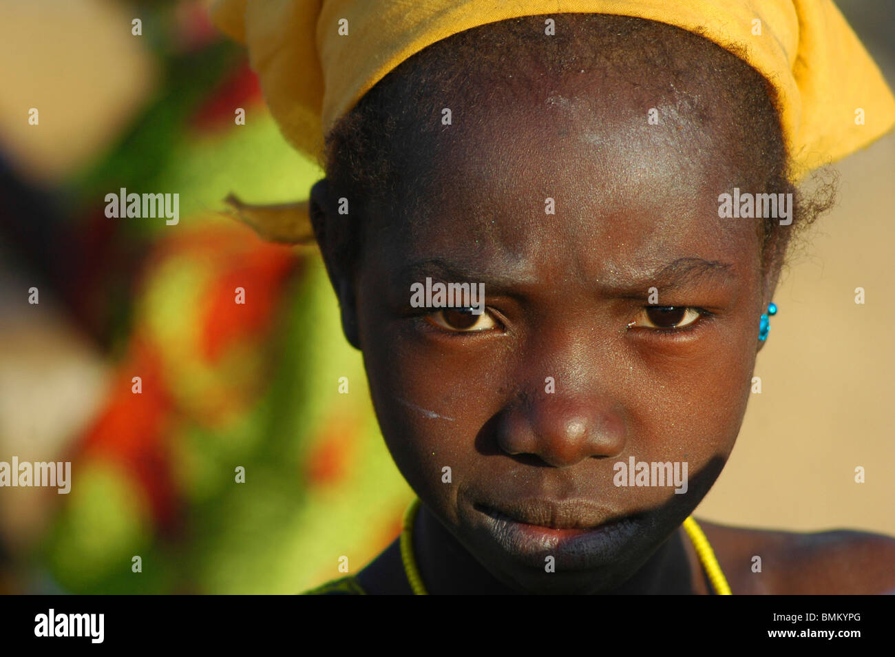 MALI, Dogon Lands. Portrait of a girl wearing a yellow scarf Stock ...