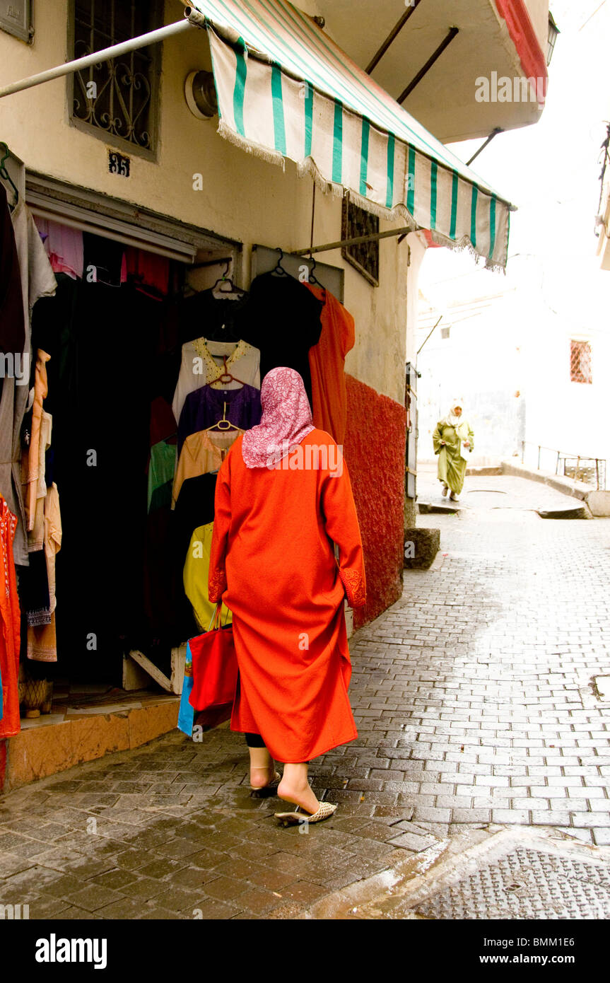 Tangier Morocco Moroccan woman in red shopping in the kasbah Stock ...