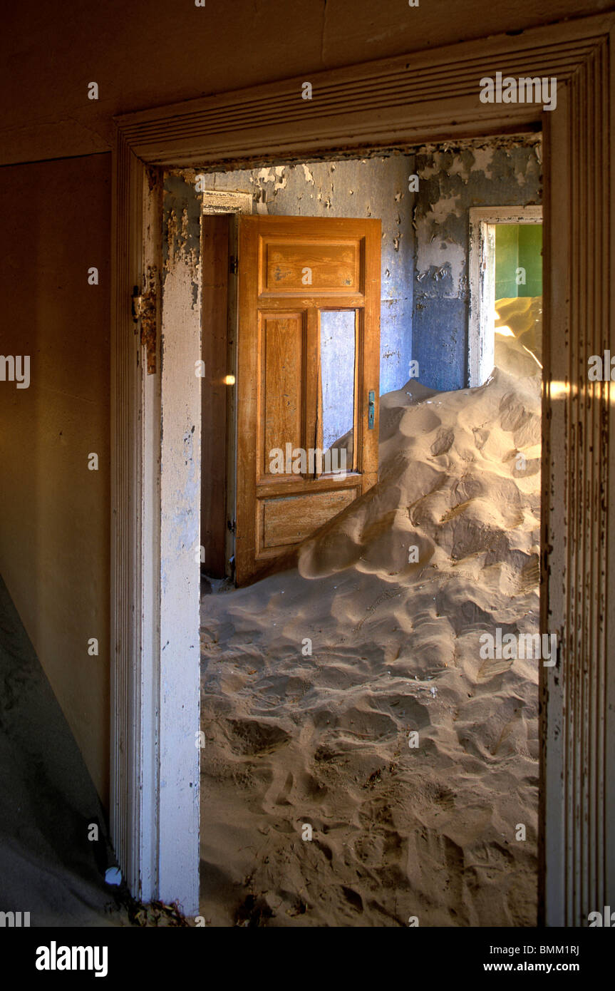 Africa, Namibia, Kolmanskop, Drifting sand fills building interior in ...