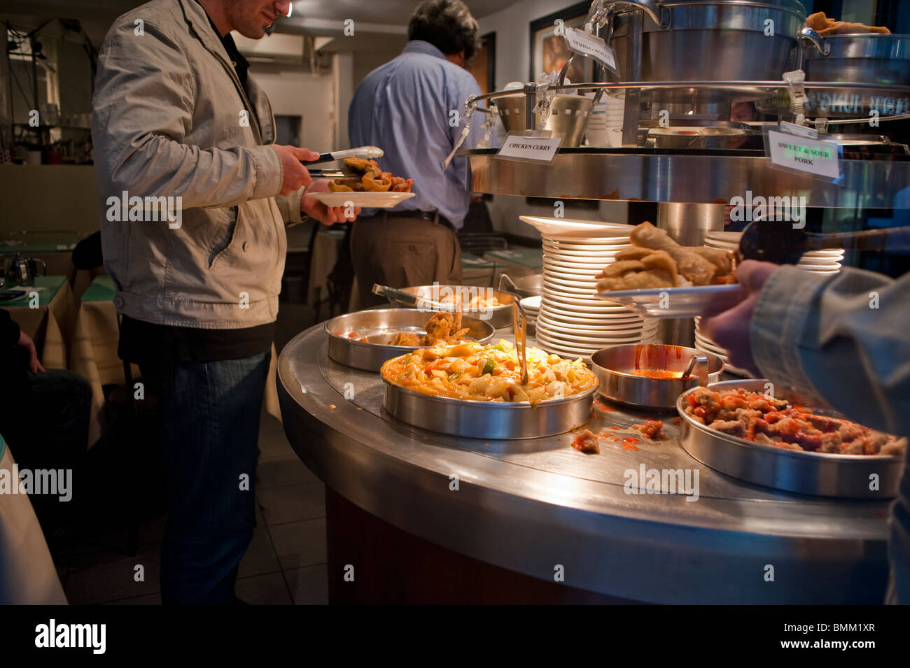 Man eating at all you can eat buffet hi-res stock photography and ...