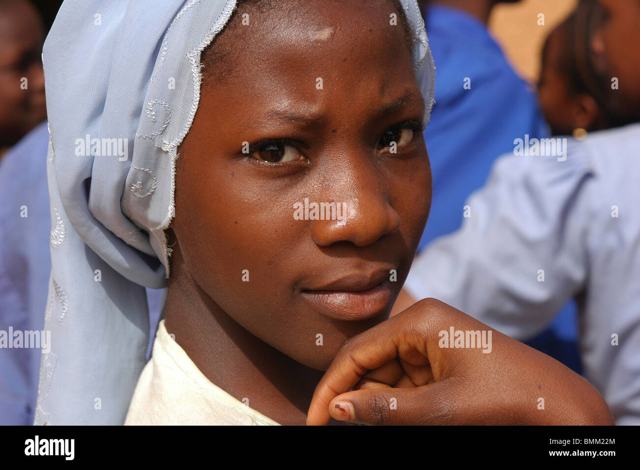 Niger Niamey Portrait of an african muslim schoolgirl with a blue scarf ...