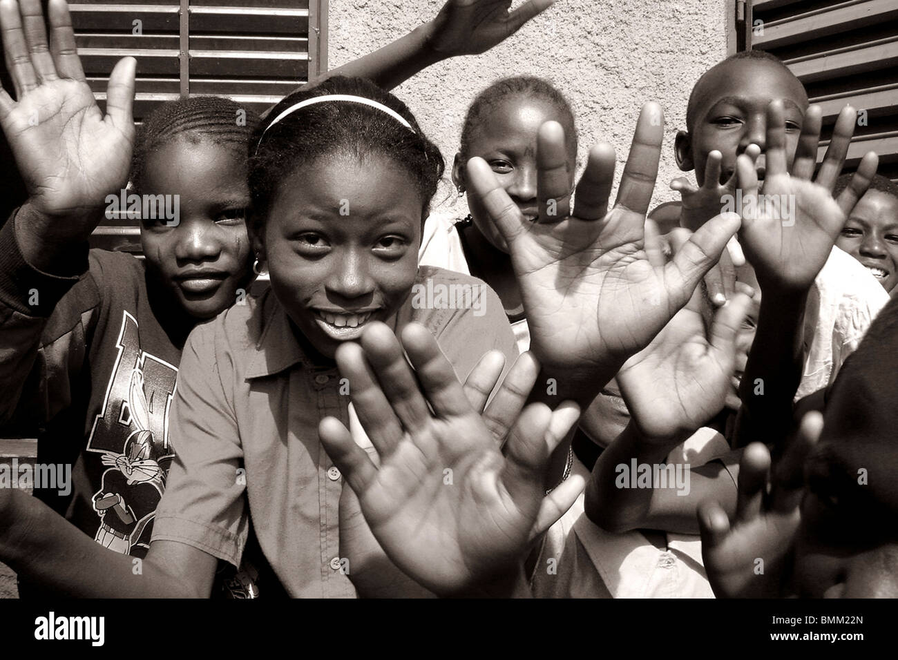 Primary school children uniform waving hi-res stock photography and ...