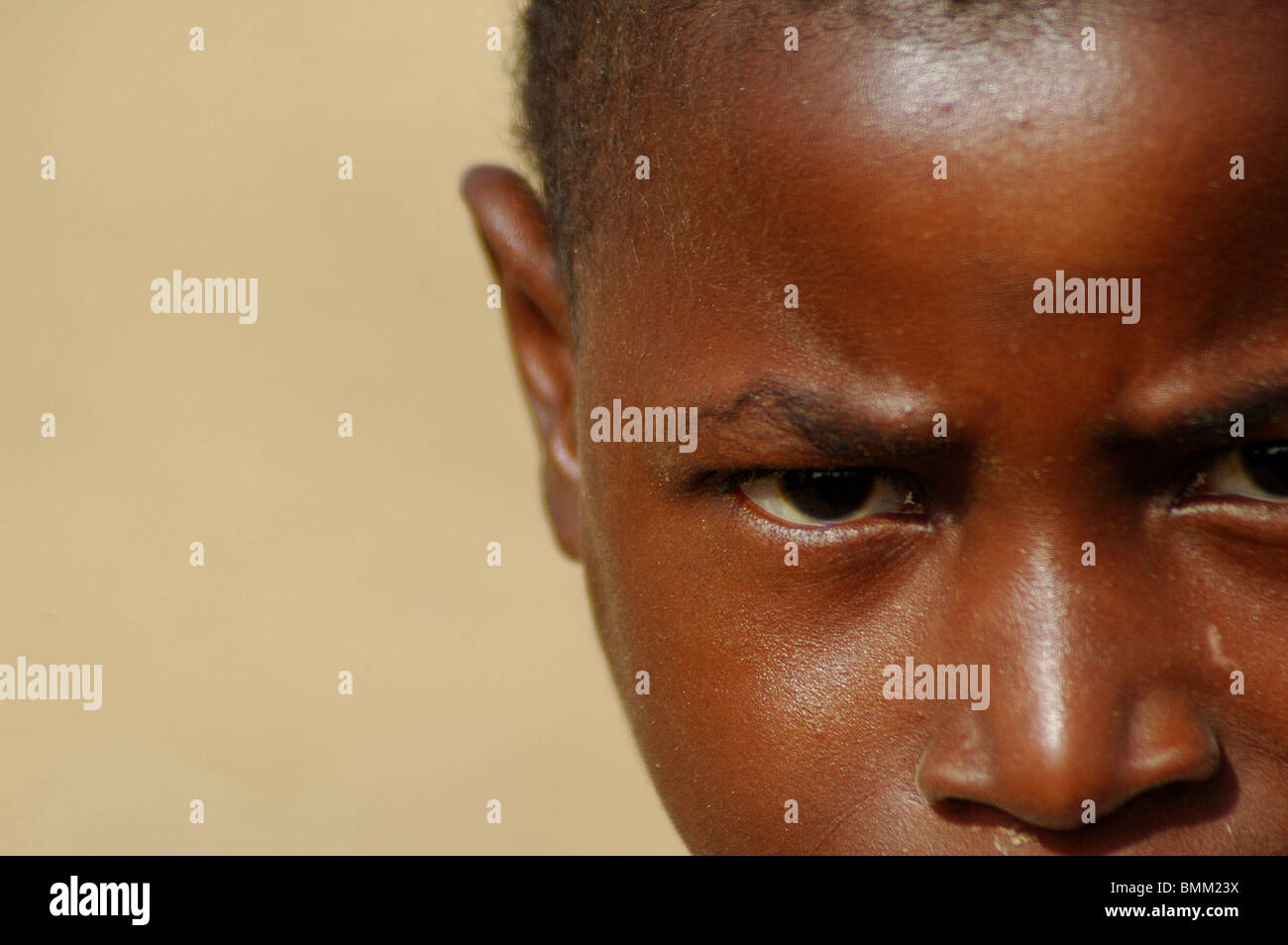 Niger, Niamey, Detail portrait of the serious look of an african ...