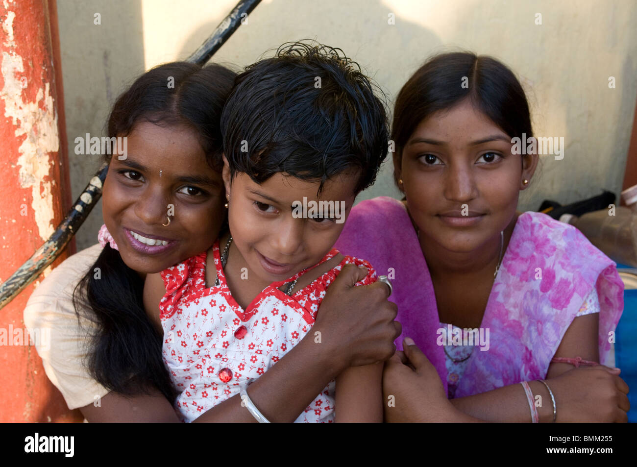 Smiling girls with their little sister. Kali Temple. Calcutta. India ...