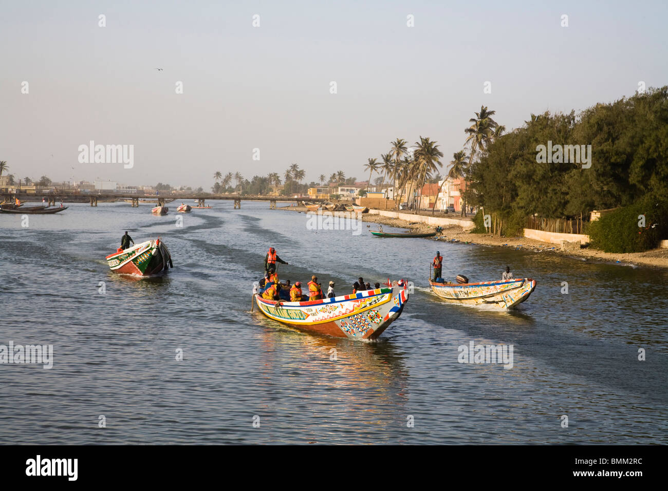 Senegal, Saint-Louis. Fishing boats heading out to sea Stock Photo - Alamy
