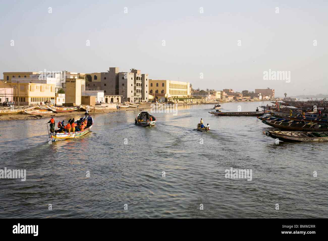 Senegal, Saint-Louis. Fishing boats heading out to sea Stock Photo - Alamy