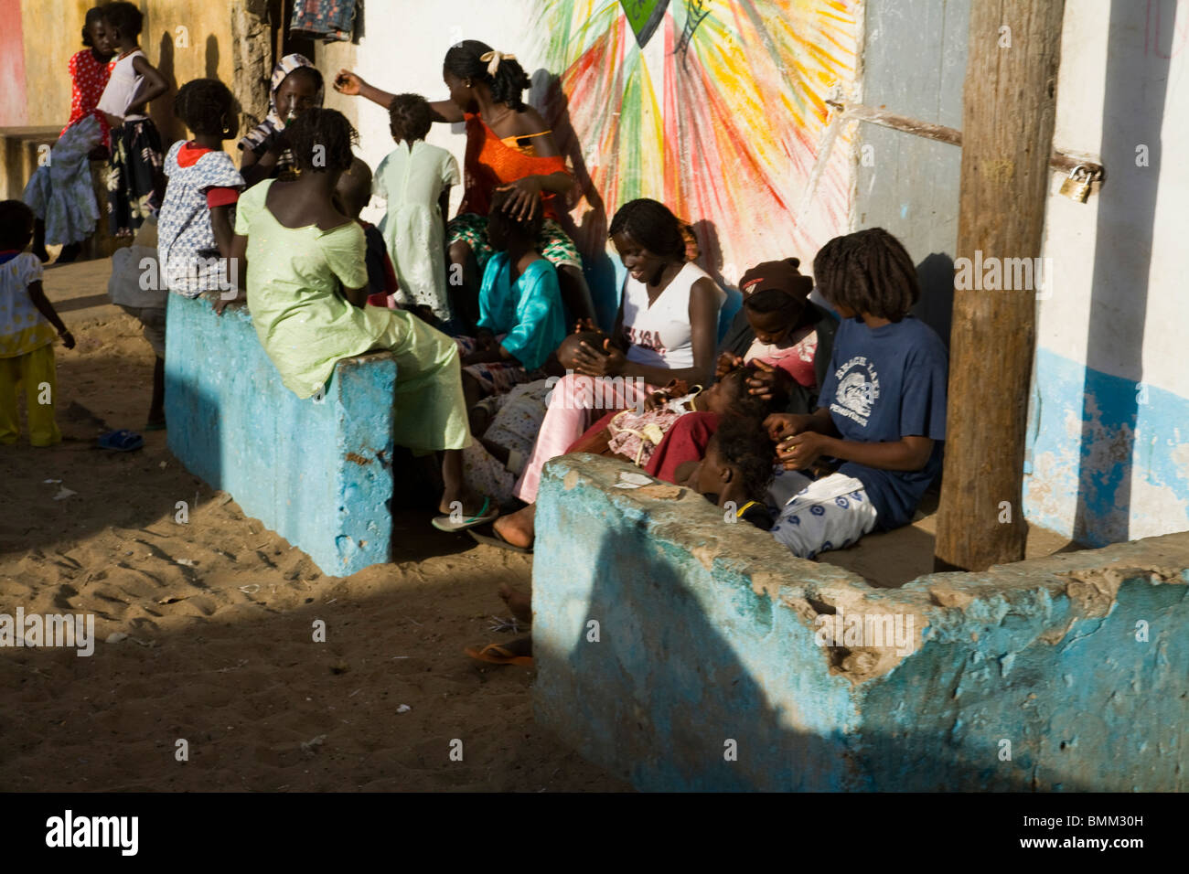 Senegal, Saint-Louis. People sitting in front of their house in Guet N ...