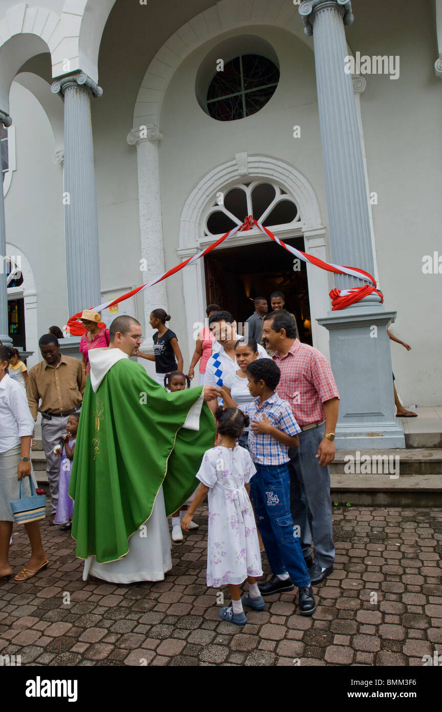 Priest greeting congregation at Immacualte Conception church Stock ...