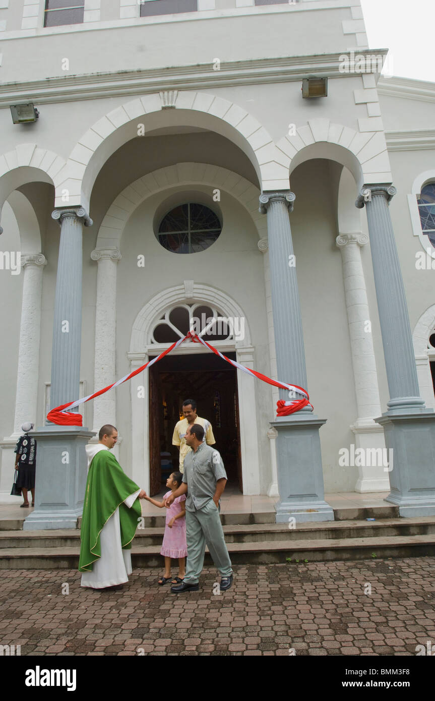Priest greeting congregation at Immacualte Conception church Stock ...