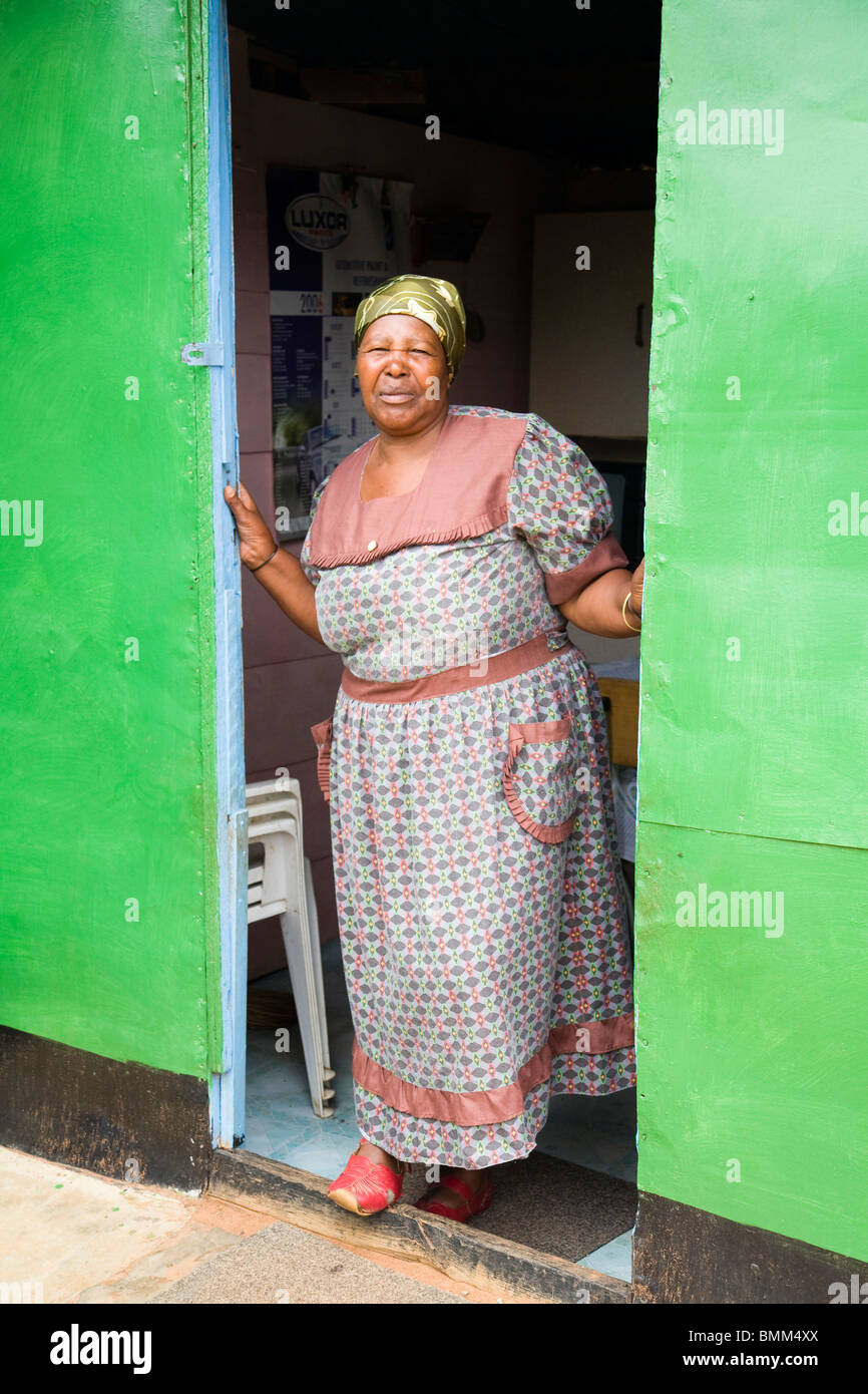 South Africa, Johannesburg. Woman at her home in a squatter camp ...