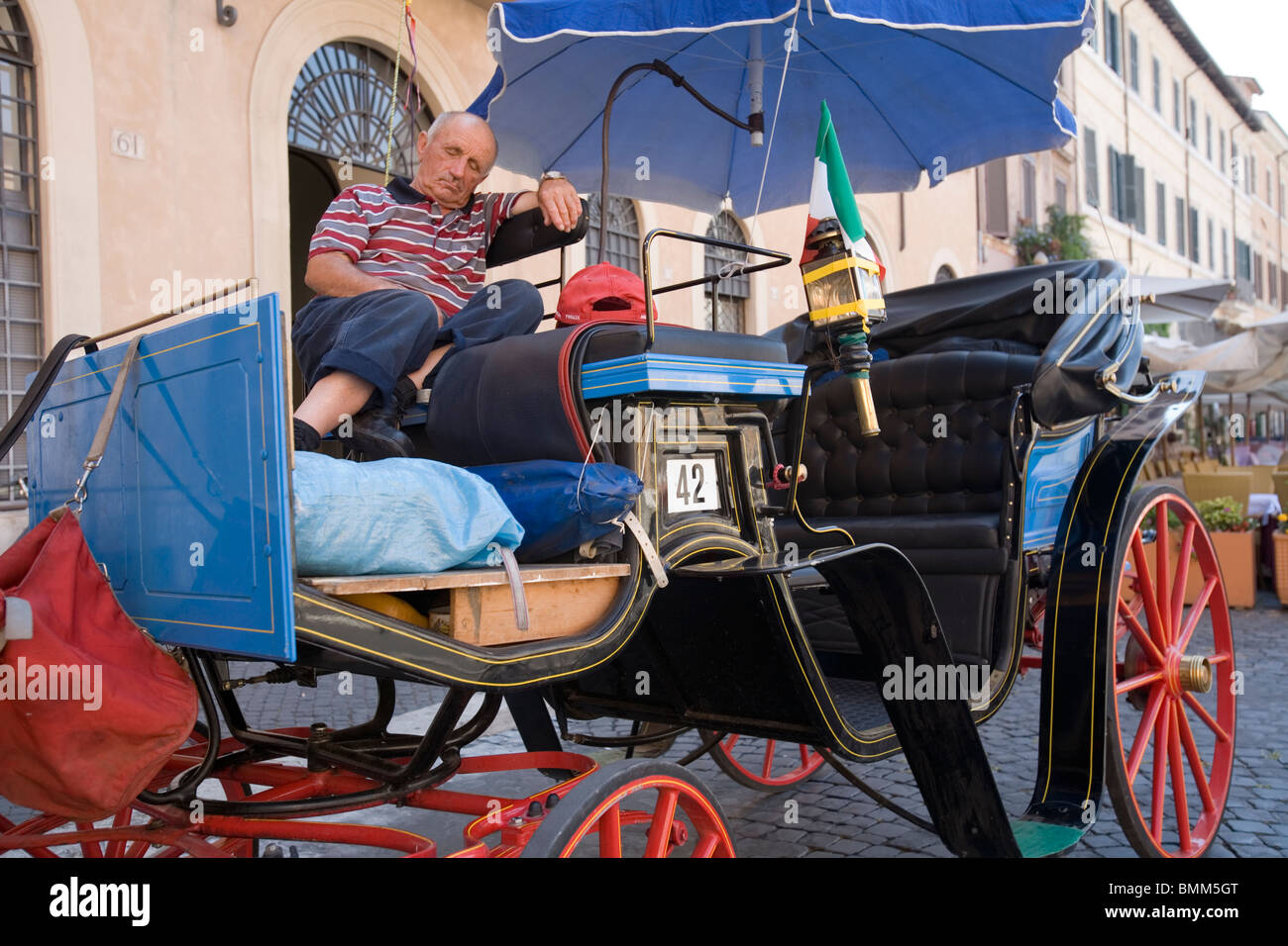 A horse-drawn carriage driver takes a nap, Rome, Italy Stock Photo - Alamy
