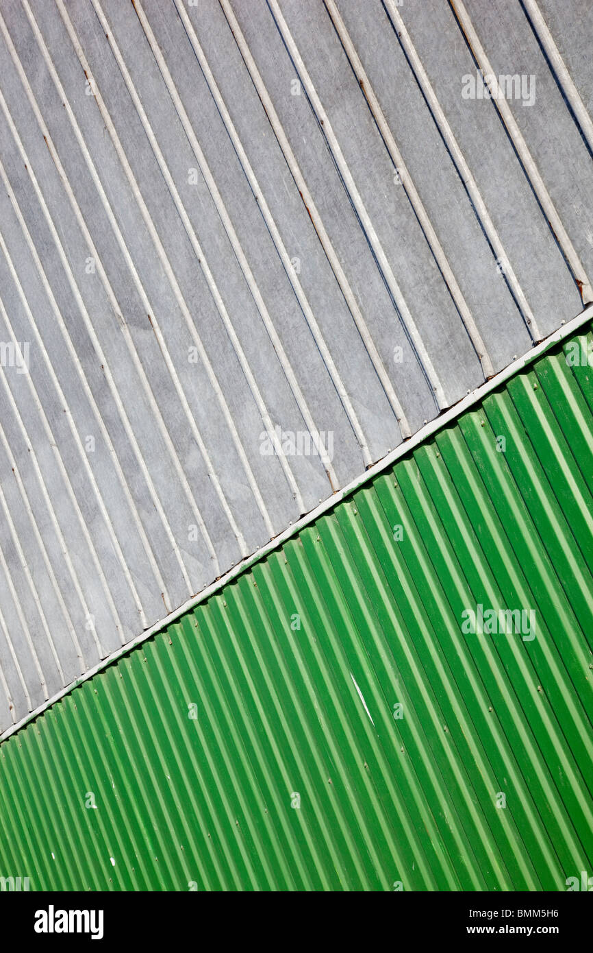 Wall covered using corrugated iron ( CGI ) sheets . Unpainted zinced ...
