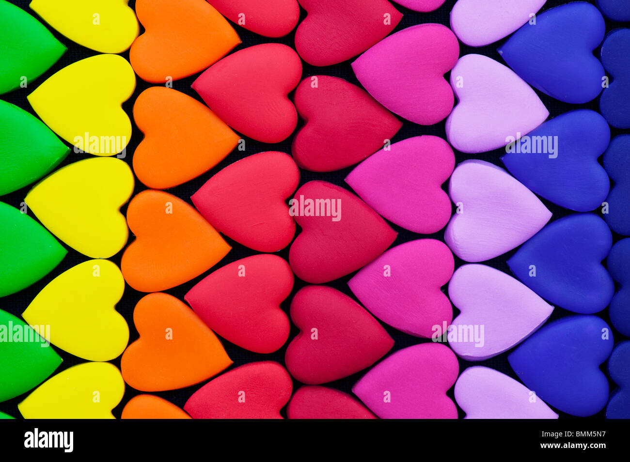 Multicoloured heart shape pattern against black background Stock Photo ... Multicoloured heart shape pattern against black background Stock Photo ...