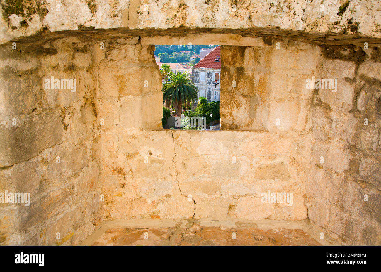 Window in the city wall Stock Photo - Alamy