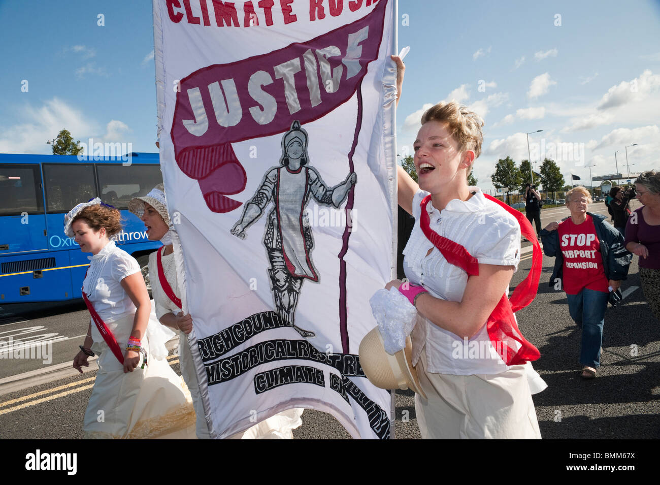 Climate Rush suffragette Tamsin Omond holds banner in protest ...
