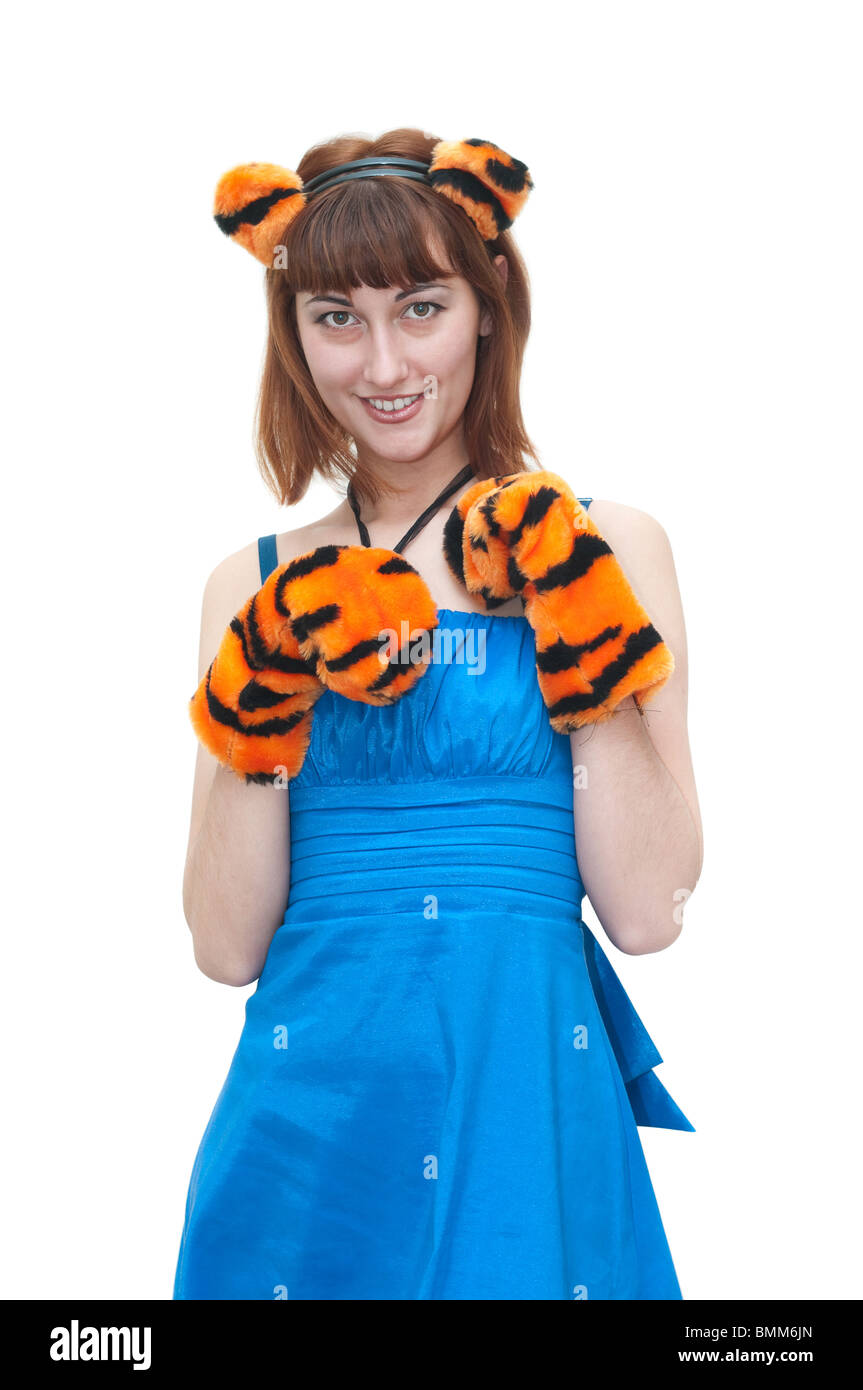 Young woman in tiger costume and in blue dress. Isolated on white ...