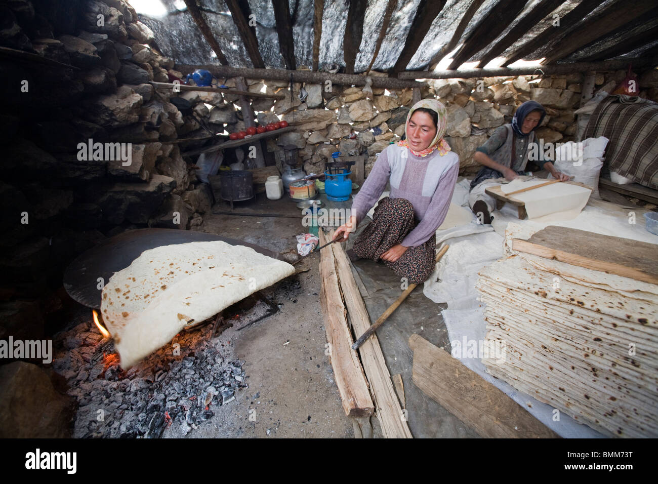 Nomadic shepherd women cooking flat bread in Taurus Mountains Mersin ...