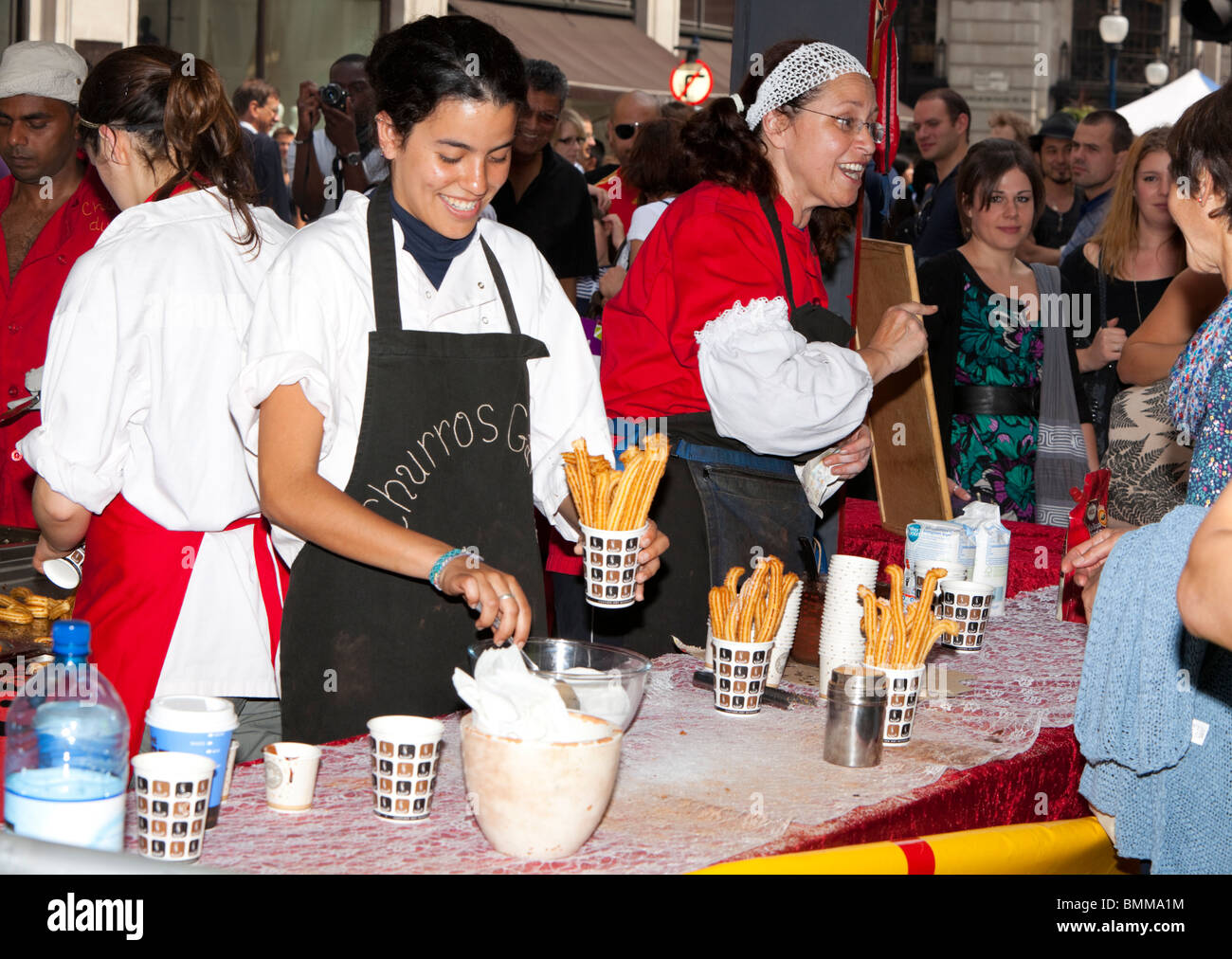 Portrait of Spanish churro vendors at a stall in London, England, UK ...
